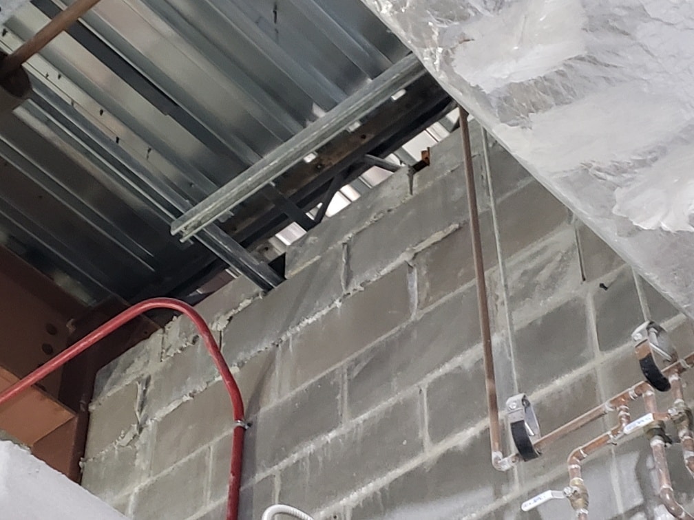 1 hour CMU wall stops at bottom of parallel bar joist - cmu he...