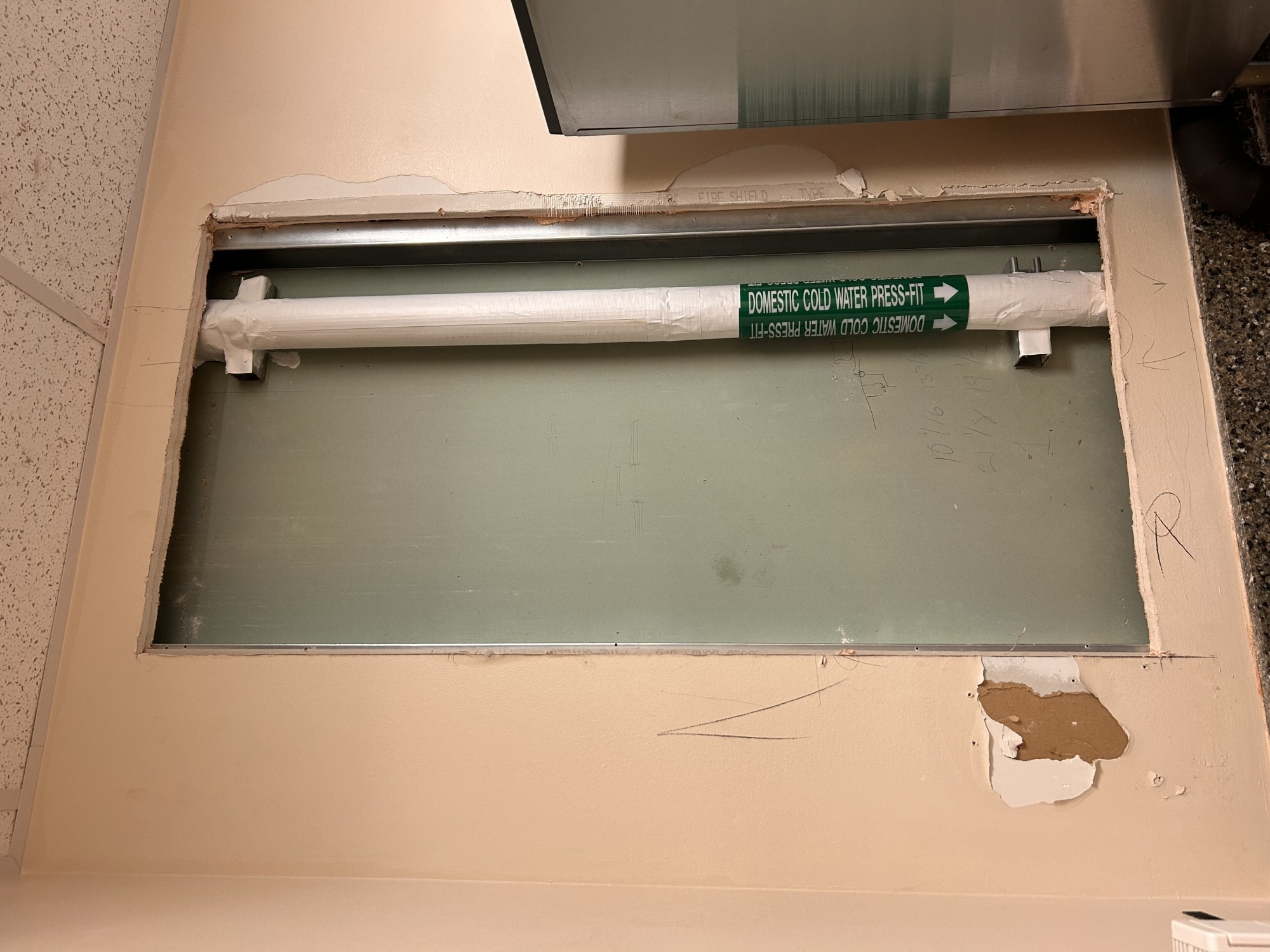 patching an opening in a 2-hr fire rated wall - 2-hr, Patching...